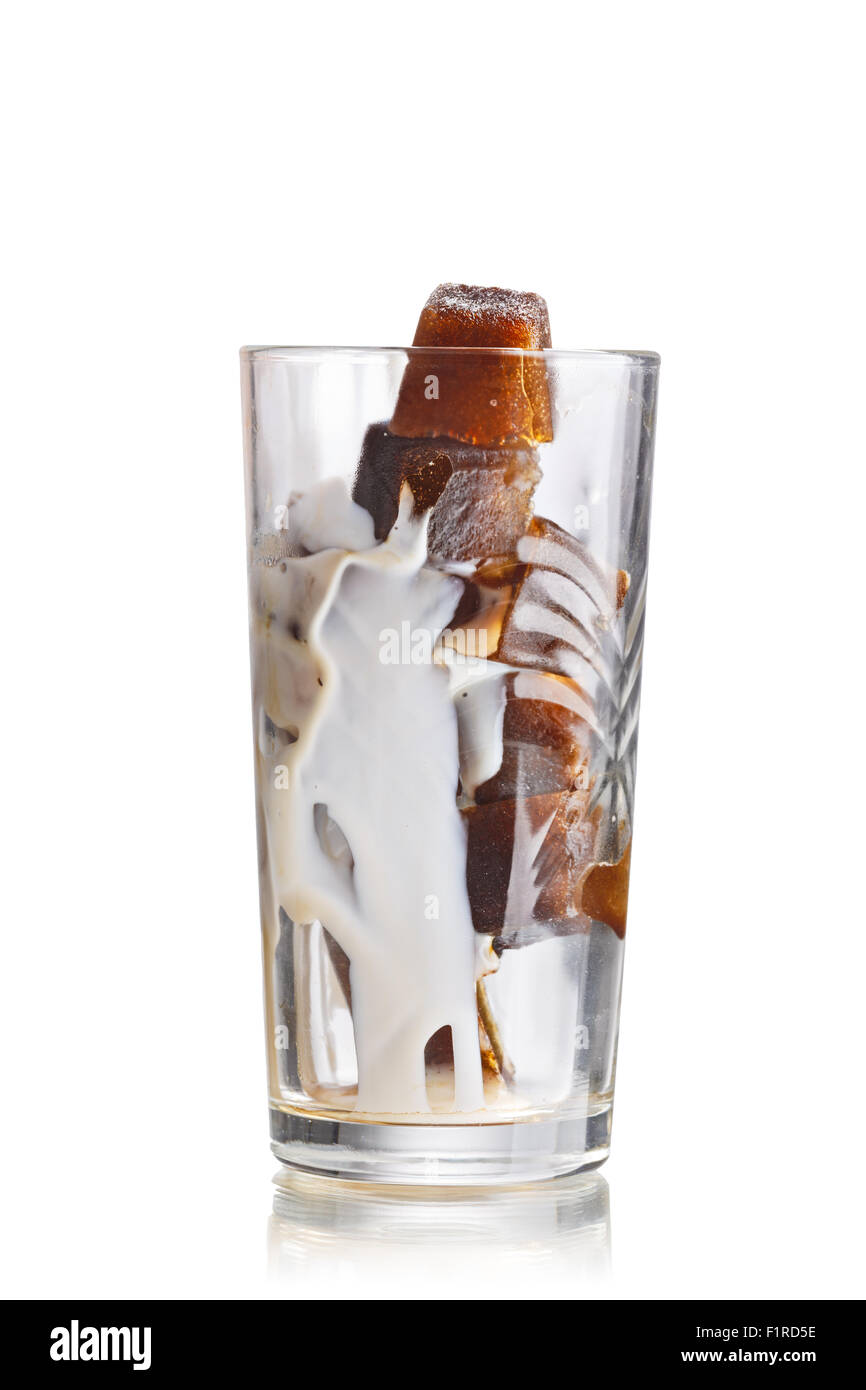 Milk coffee cocktail from frozen coffee cubes in highball glass. Iced ...