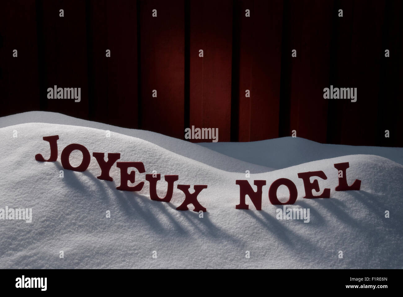 Joyeux Noel Means Merry Christmas On Snow Stock Photo - Alamy