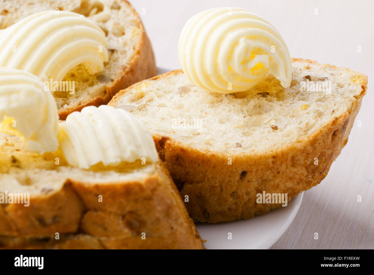 Butter curls on a slices of bread. Healthy breakfast Stock Photo - Alamy