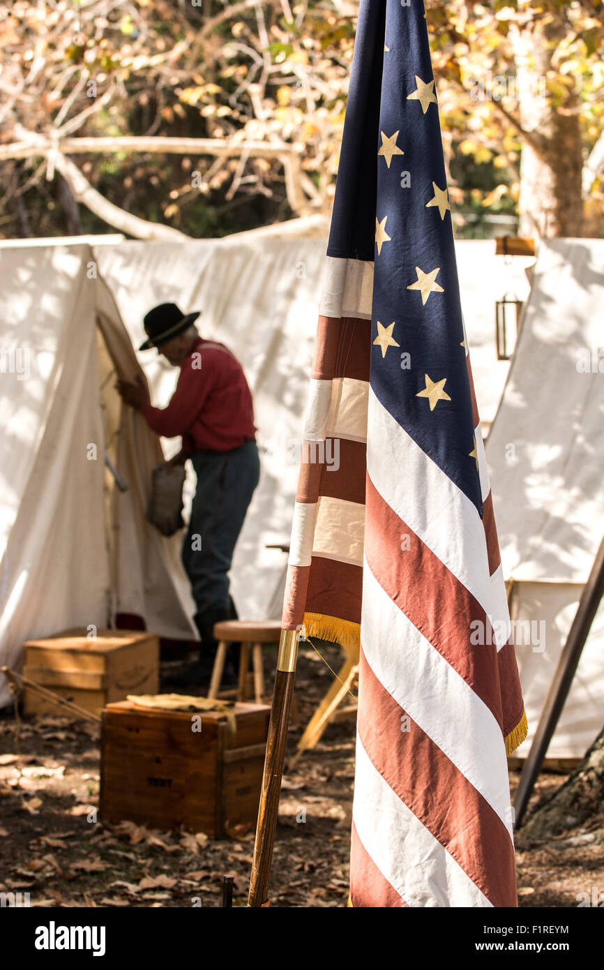 An American flag in the center of a group of tents housing Union troops ...