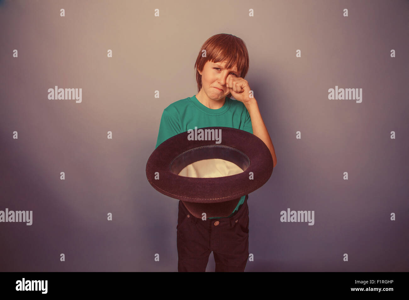 European-looking boy of ten years beggar, poor, asks for money o Stock ...