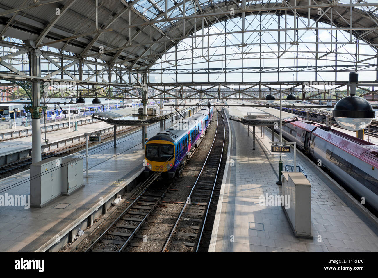 The inside of Manchester Piccadilly railway train station on a sunny ...