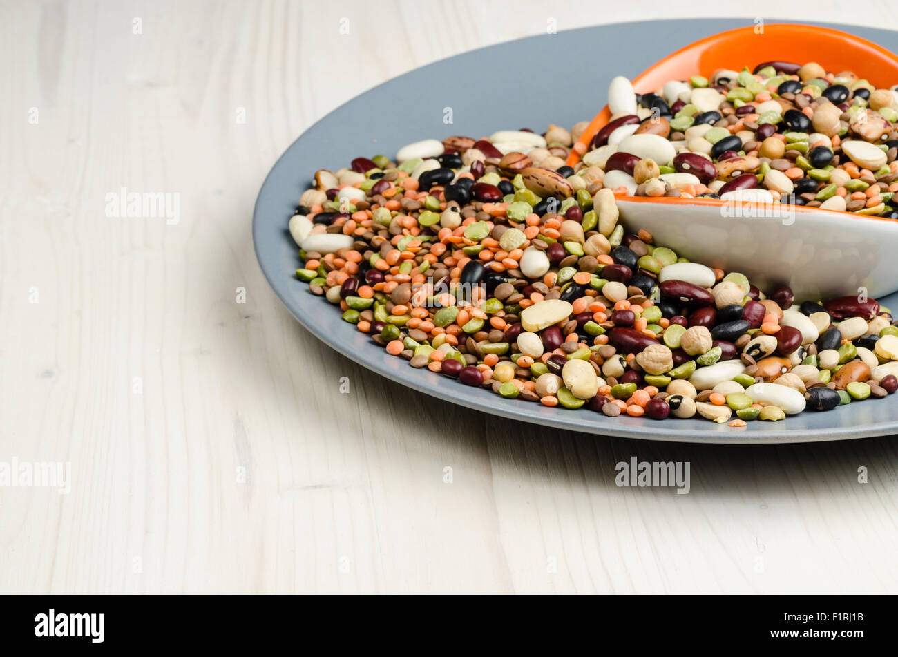 legumes in a dish on table, close up, background Stock Photo - Alamy