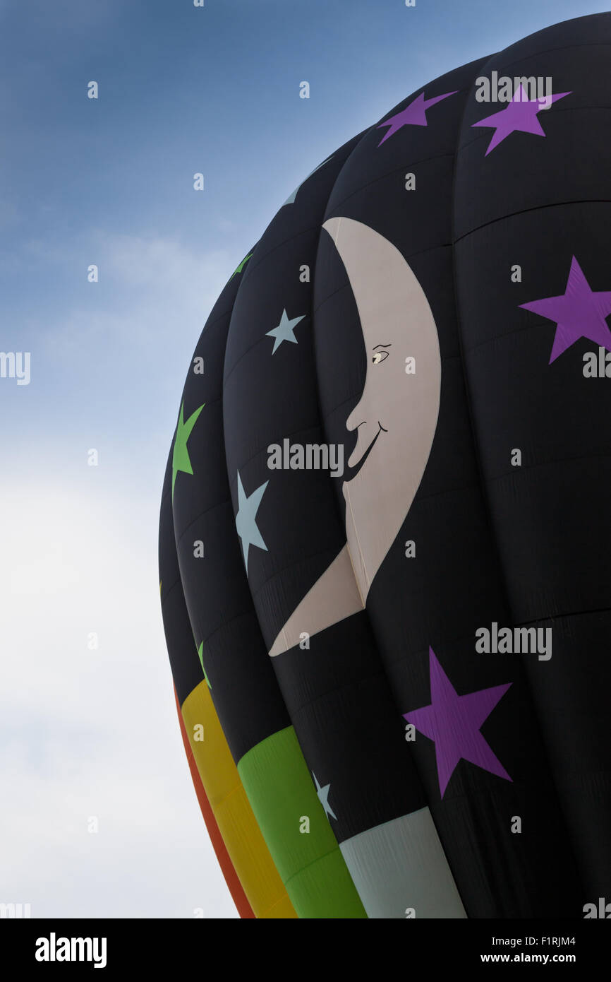 A close up side view of a celestial hot air balloon with a crescent ...