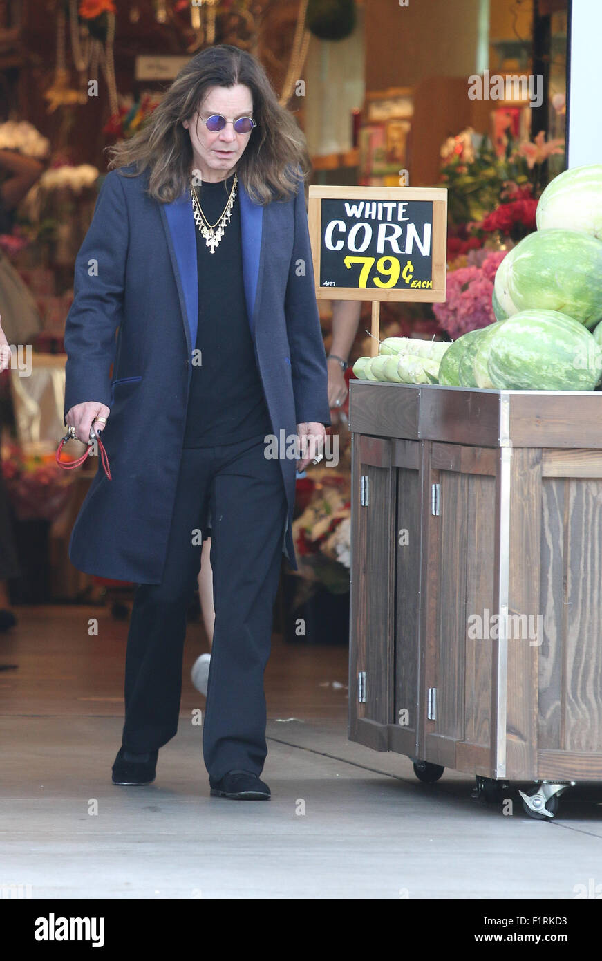 Ozzy Osbourne shopping at Bristol Farms in Beverly Hills wearing a long ...