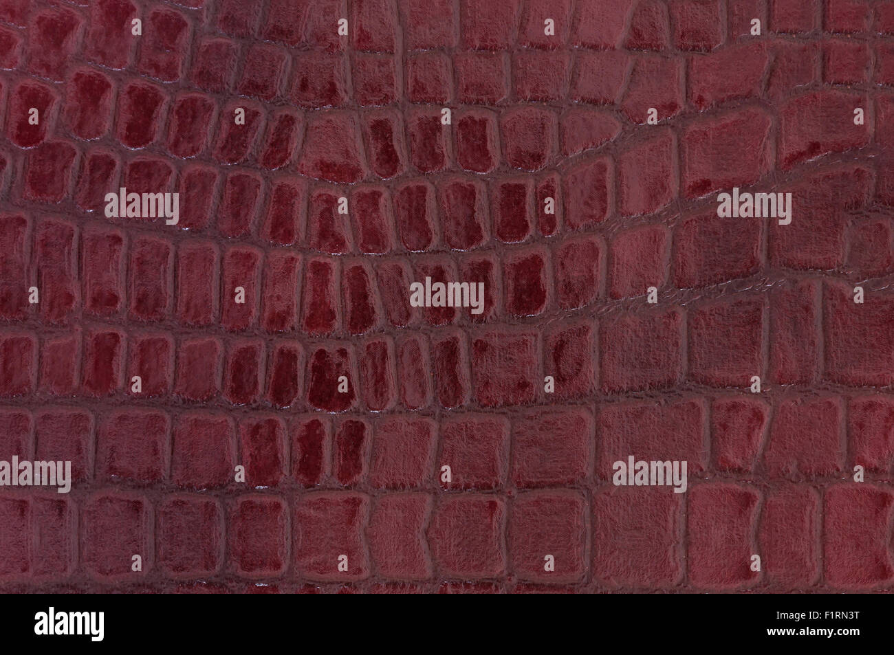 Dark red colored crocodile leather texture as abstract background Stock ...
