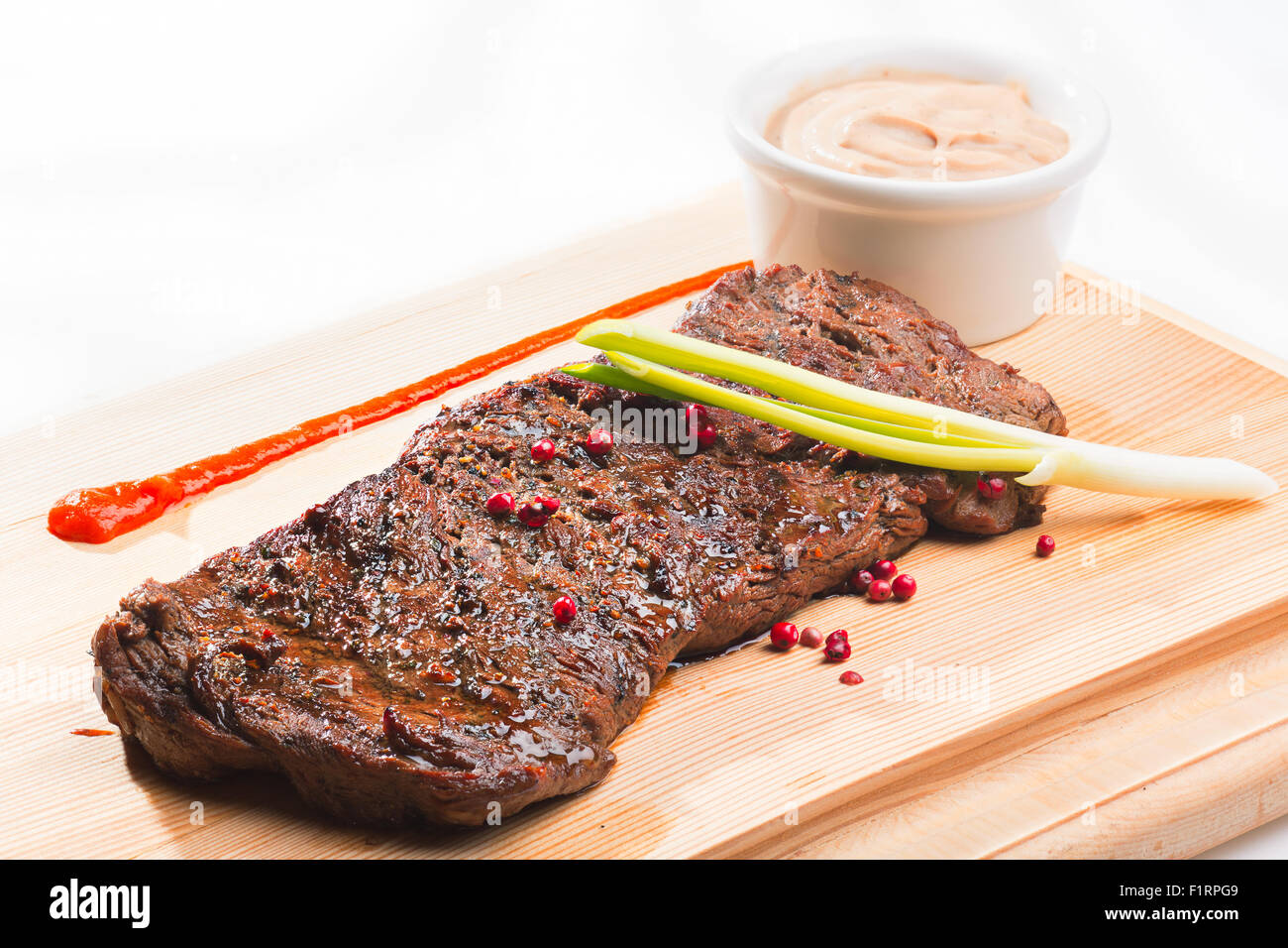 Grilled beef steak isolated on white. Steak BBQ. Hearty steak dinner ...