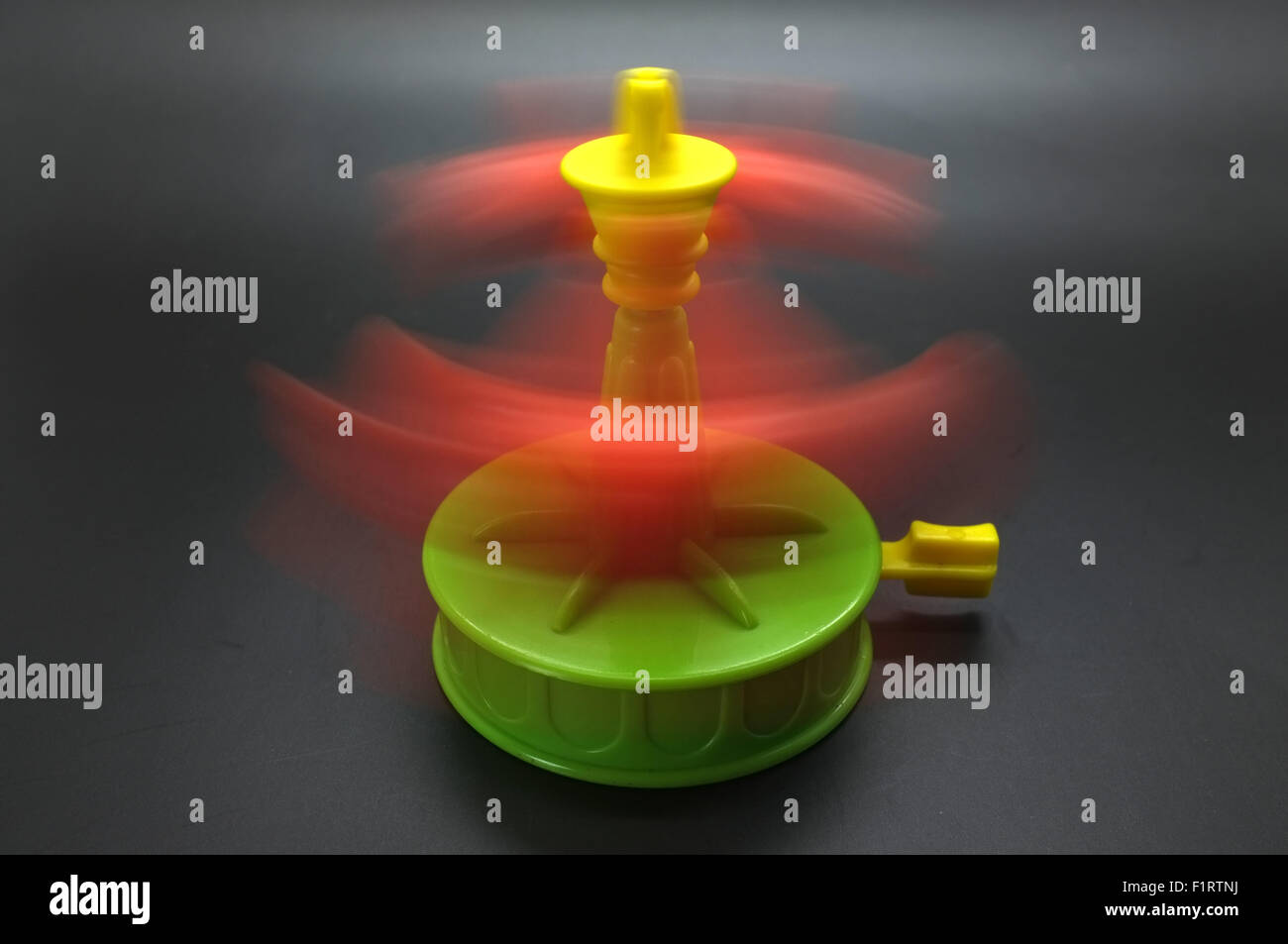 Amusement spinning toy with motion blur Stock Photo - Alamy