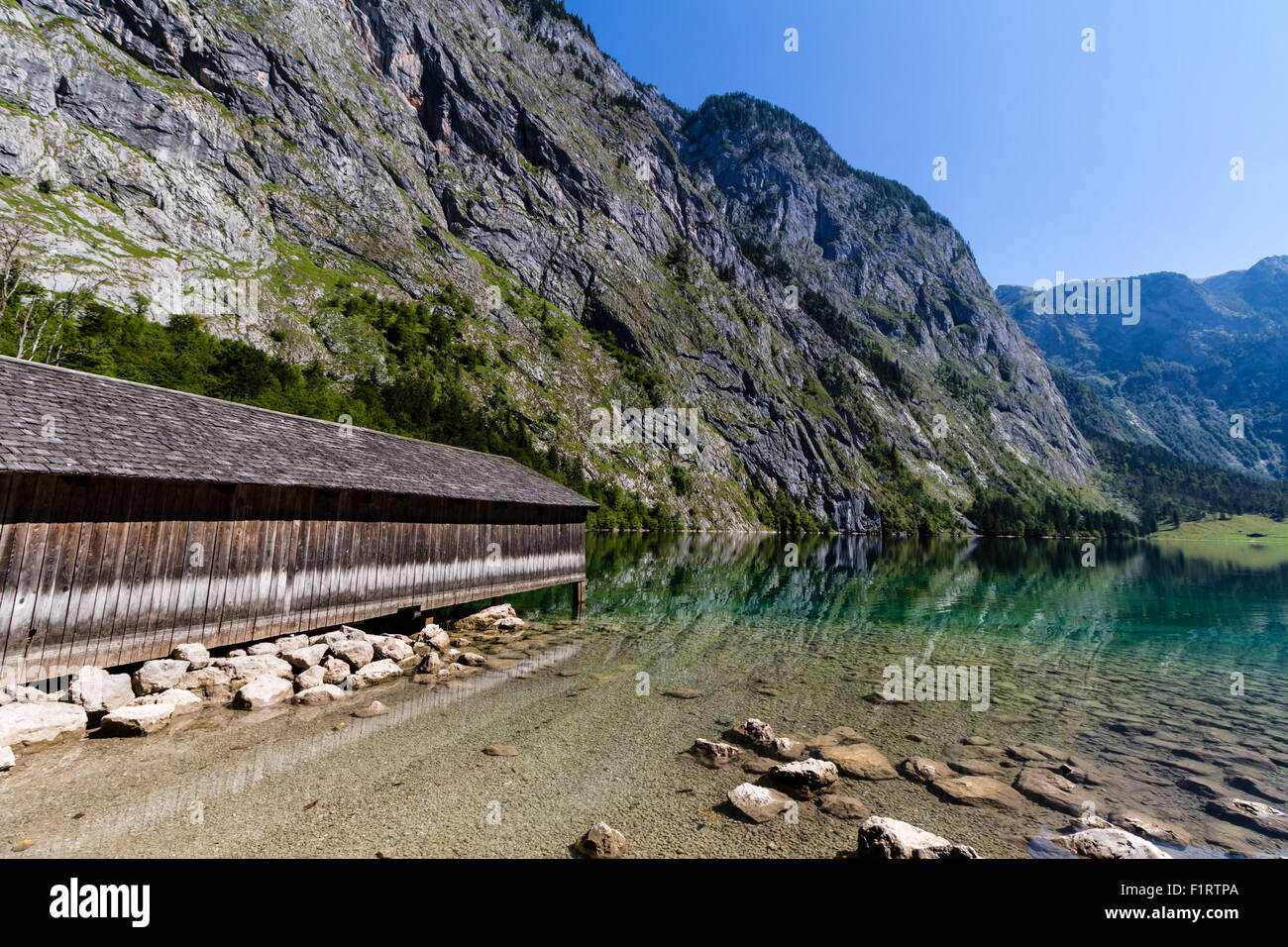 Beautiful landscape of alpine lake with crystal clear green water and ...