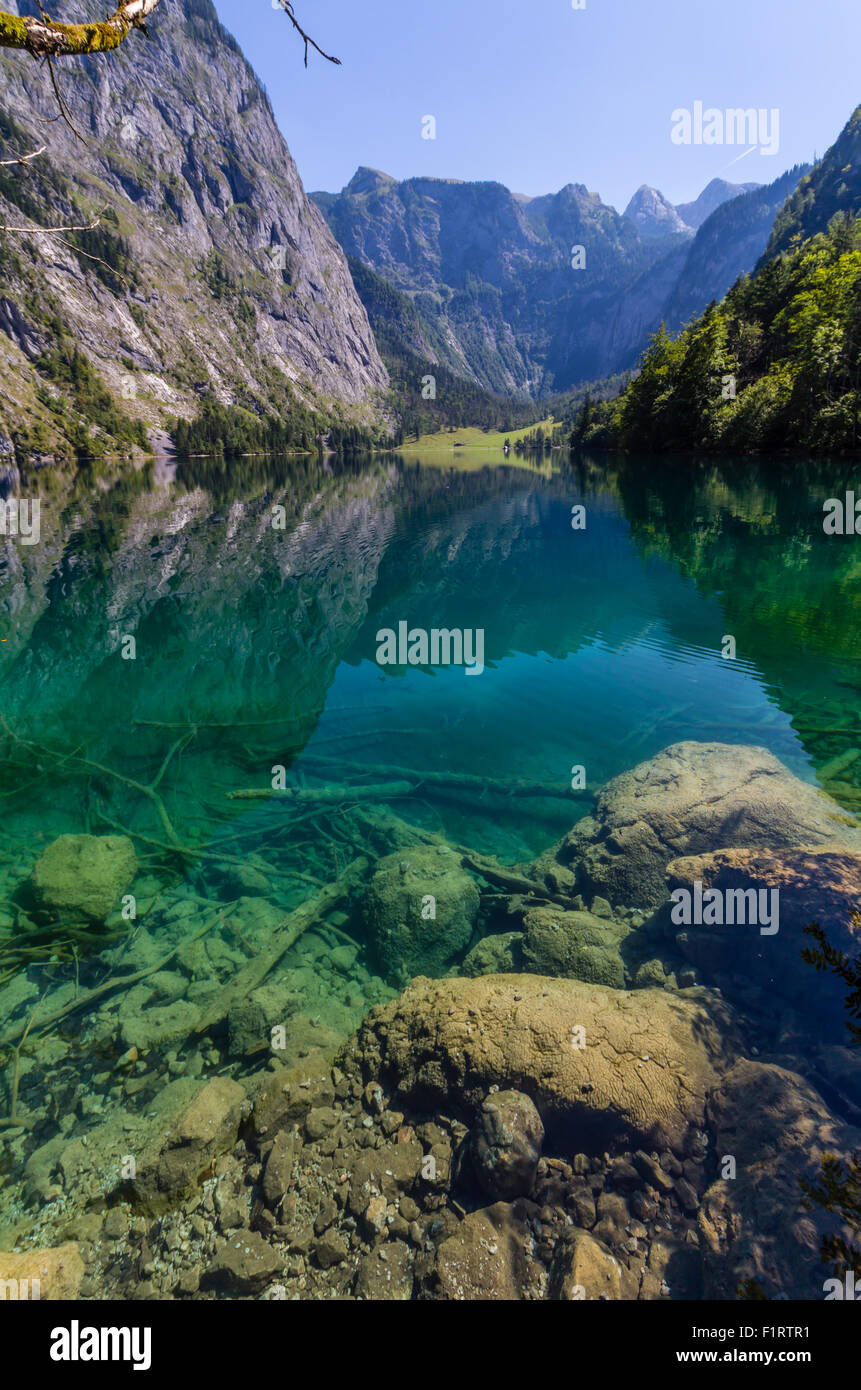 Beautiful landscape of alpine lake with crystal clear green water and ...