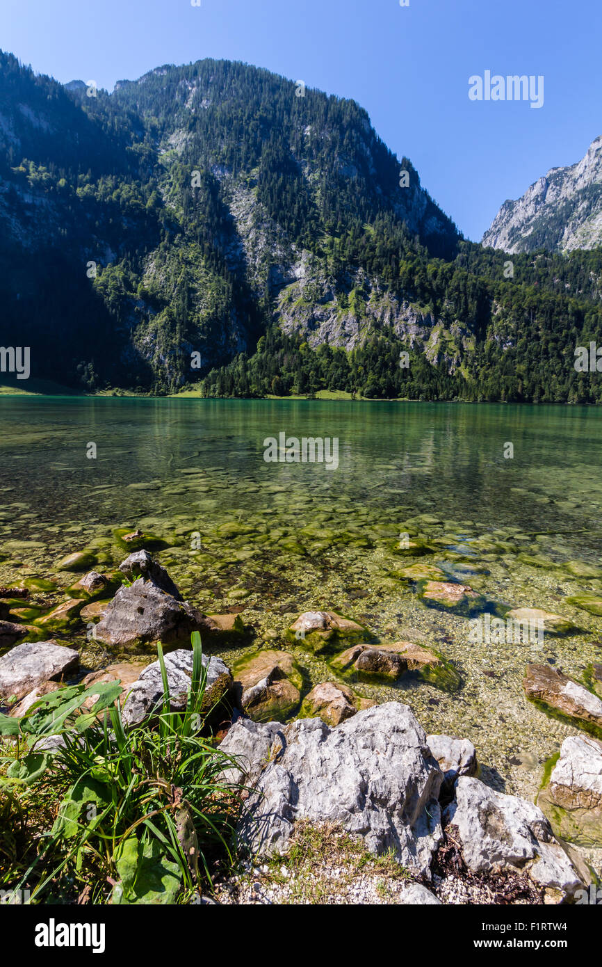 Beautiful landscape of alpine lake with crystal clear green water and ...