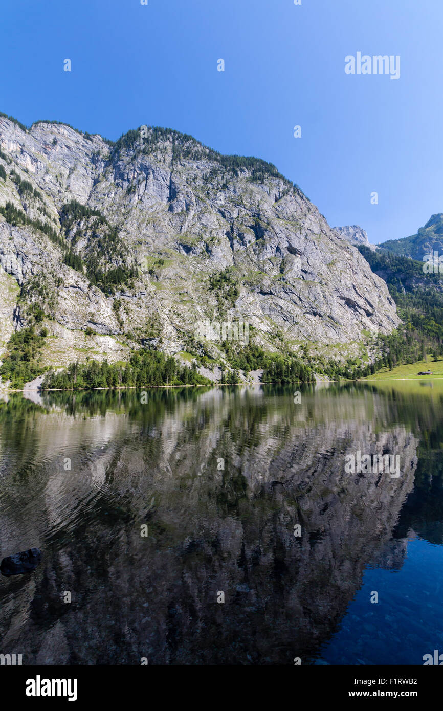 Beautiful landscape of alpine lake with crystal clear green water and ...