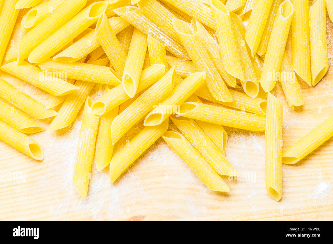Maccheroni pasta on the table top view Stock Photo - Alamy