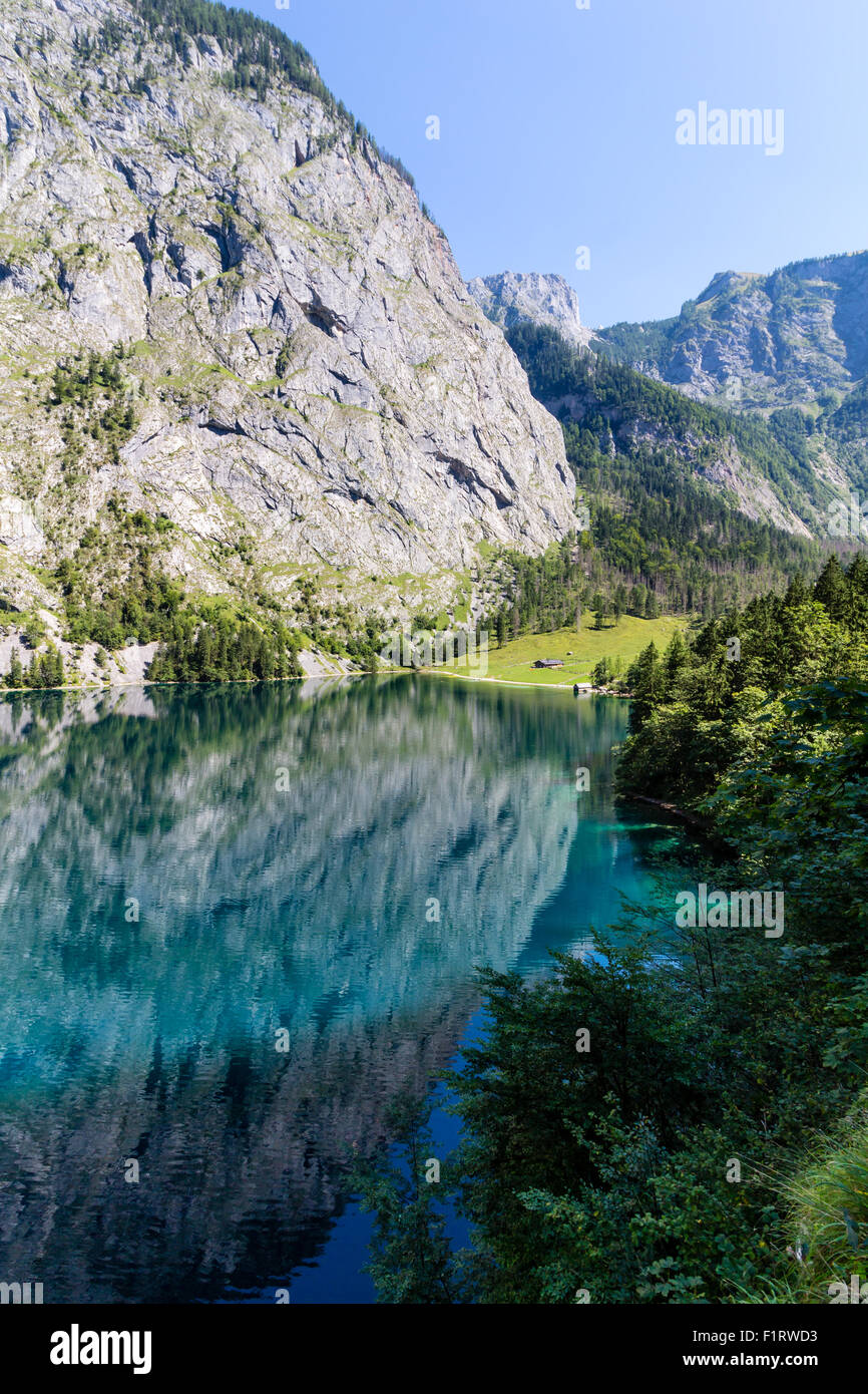 Beautiful landscape of alpine lake with crystal clear green water and ...
