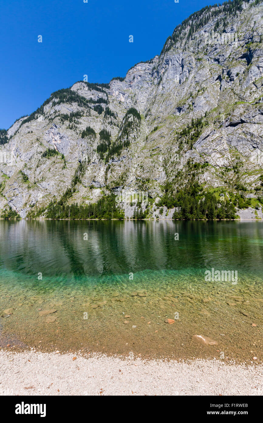 Beautiful landscape of alpine lake with crystal clear green water and ...