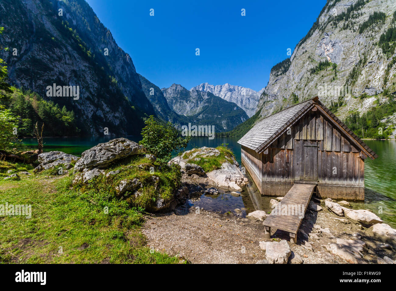 Beautiful landscape of alpine lake with crystal clear green water and ...