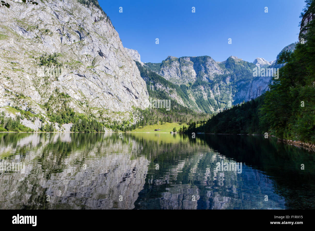 Beautiful landscape of alpine lake with crystal clear green water and ...