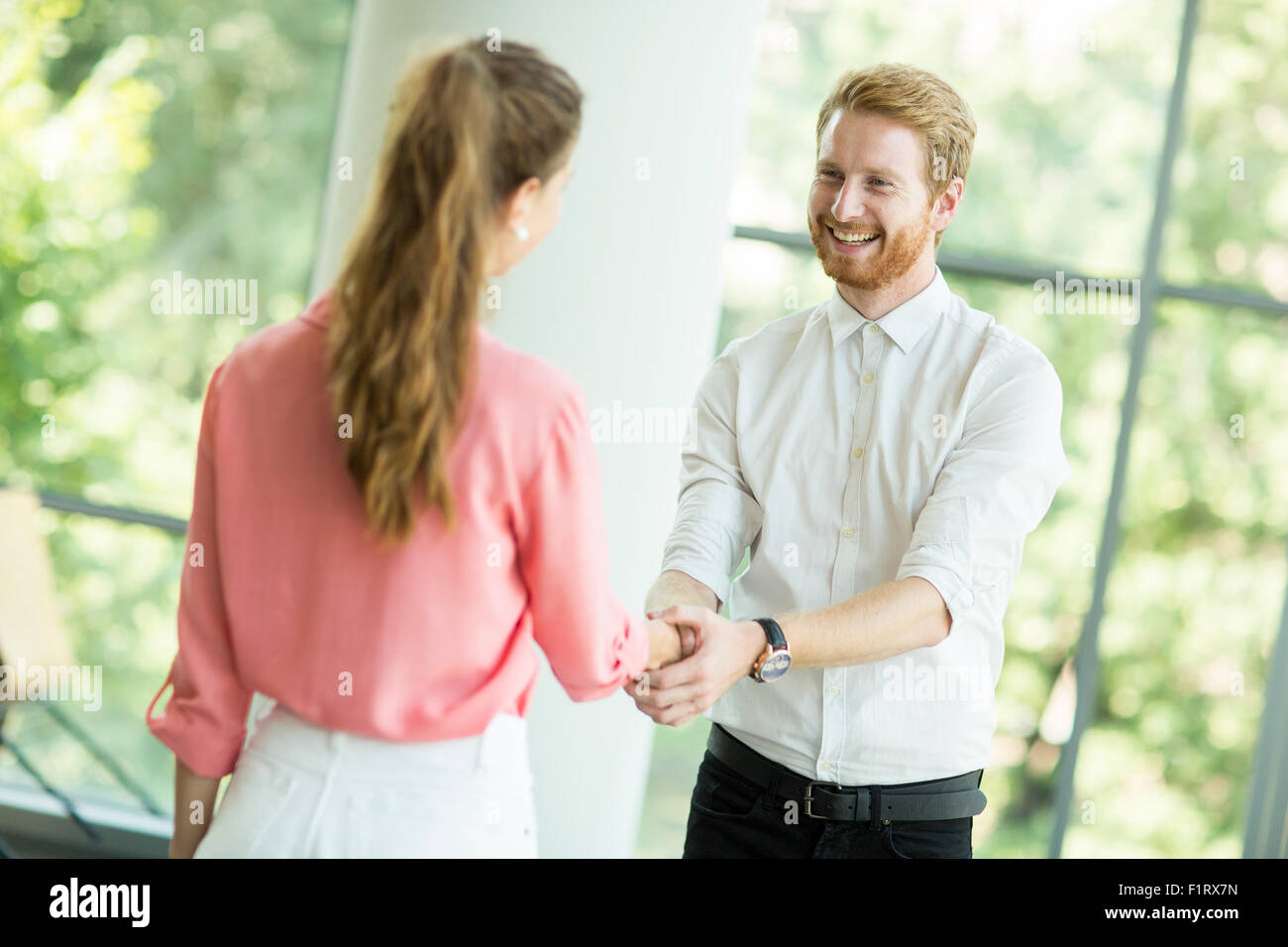 Man woman handshake office hi-res stock photography and images - Alamy