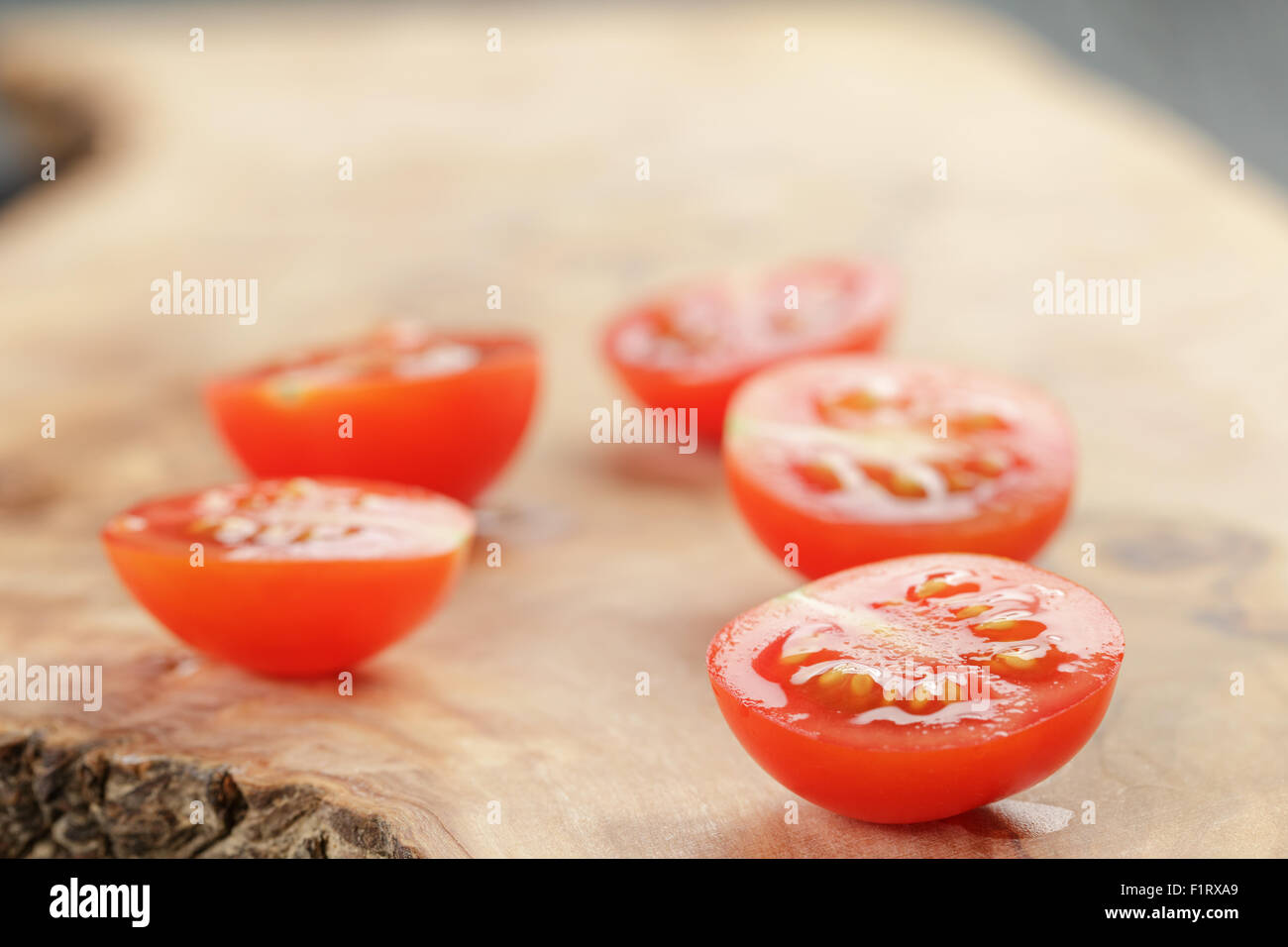 Cherry tomato on cutting hi-res stock photography and images - Alamy