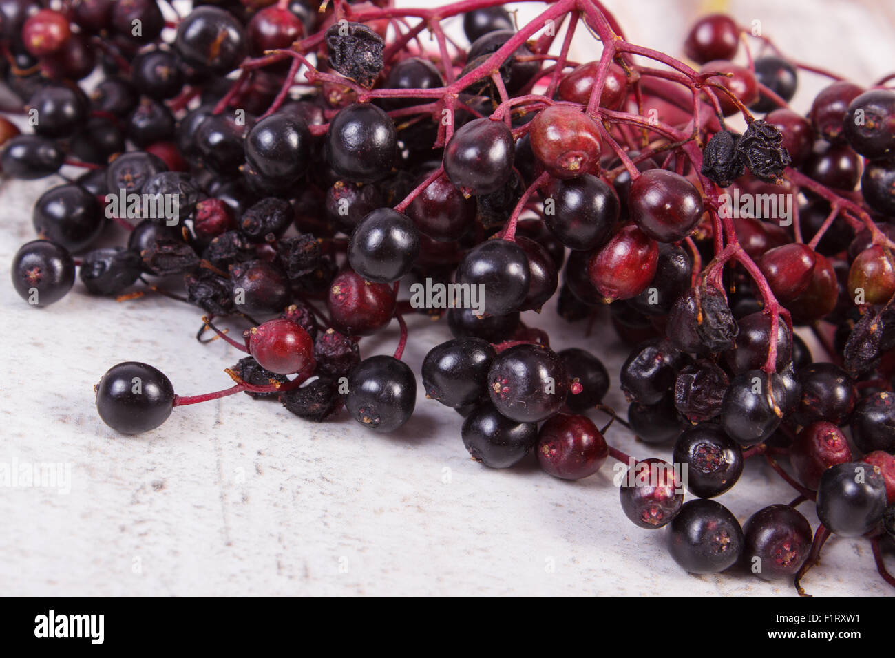 Bunch of fresh elderberry on old rustic wooden background, healthy food ...