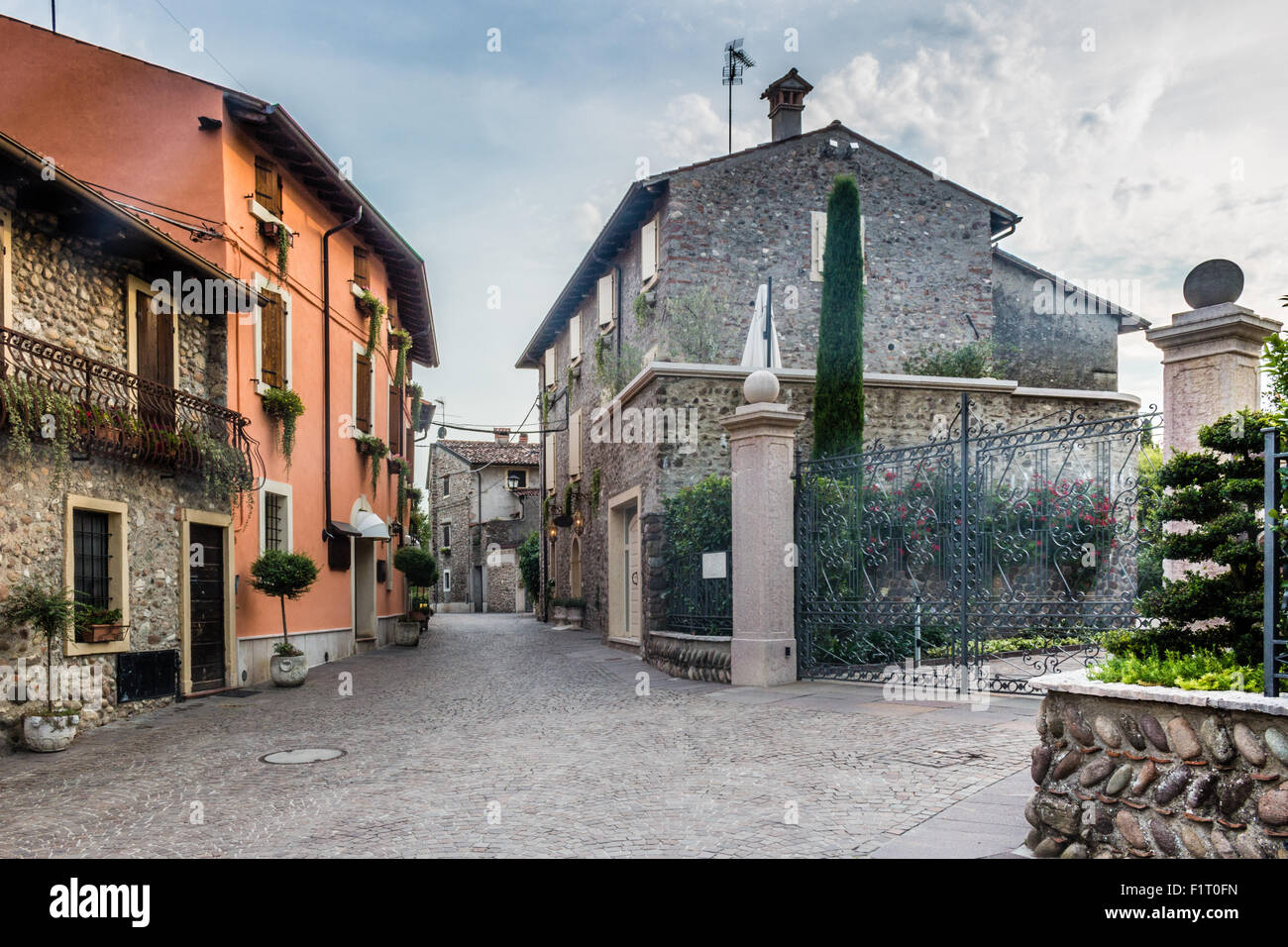 Narrow alleys and ancient buildings of a typical Italian medieval ...