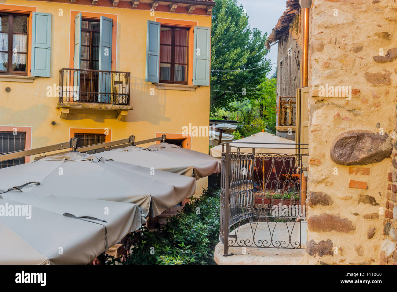 Narrow alleys and ancient buildings of a typical Italian medieval ...