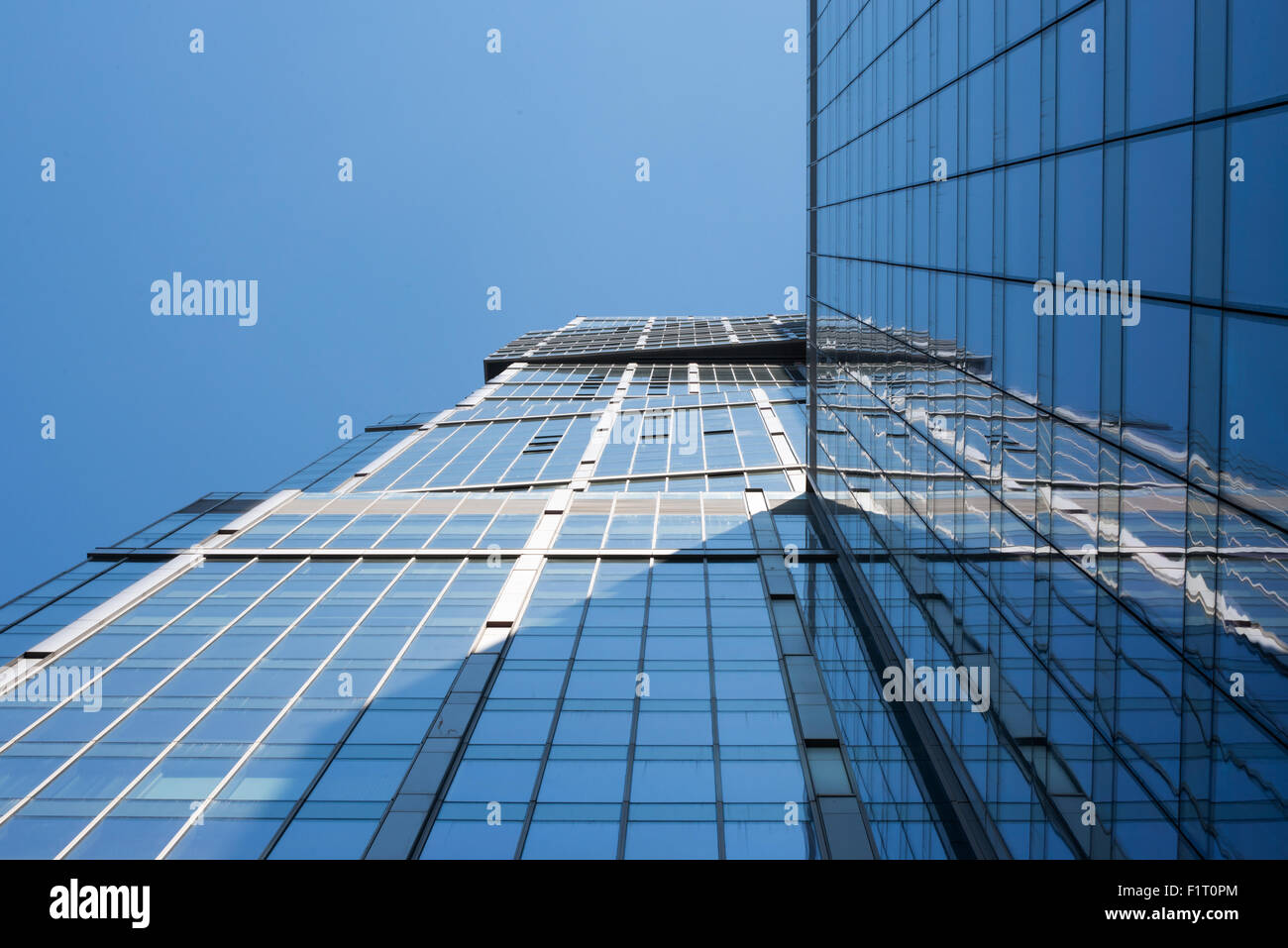 High-rise buildings on blue sky, bottom view Stock Photo - Alamy
