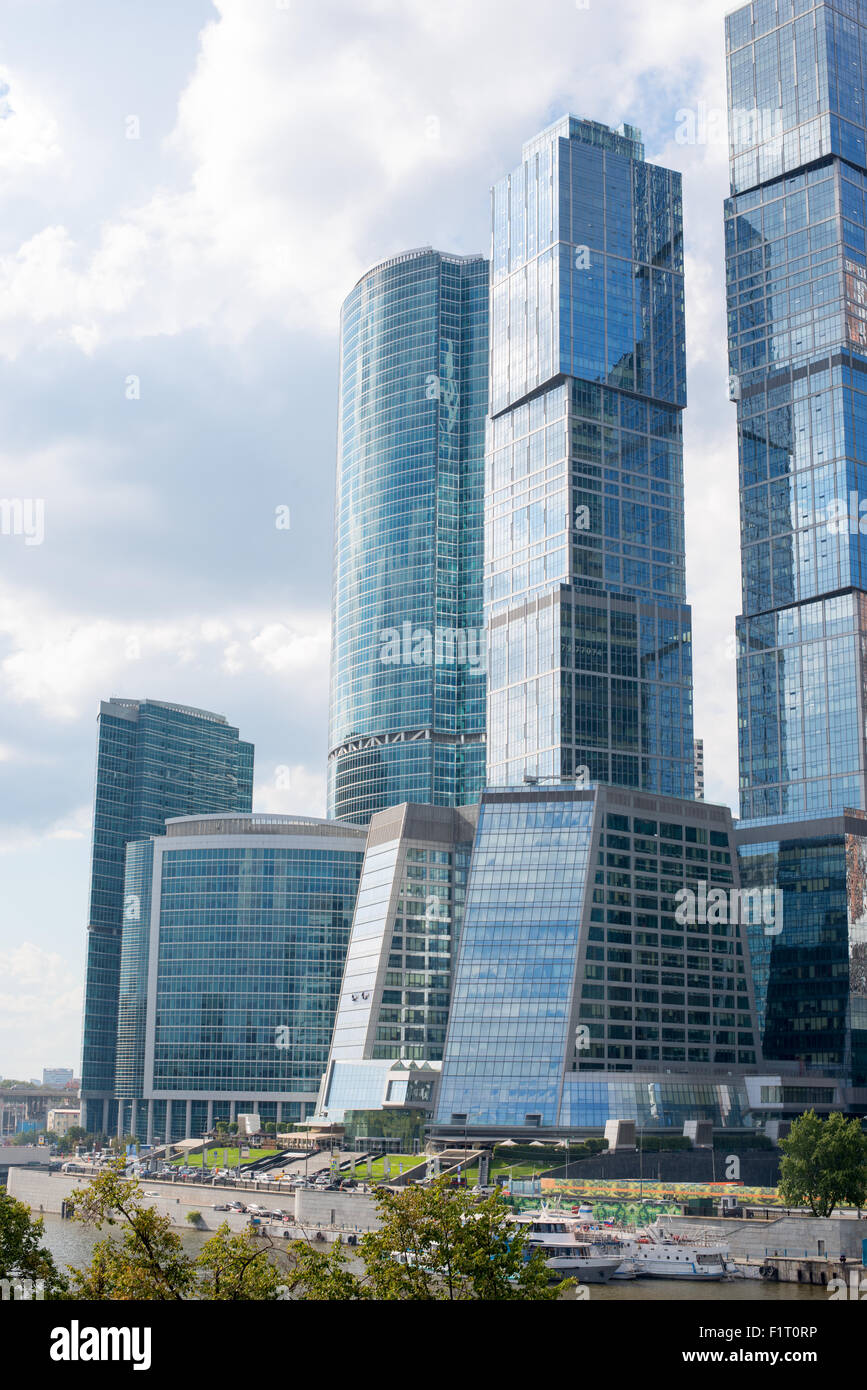 High-rise buildings on blue sky and trees Stock Photo - Alamy