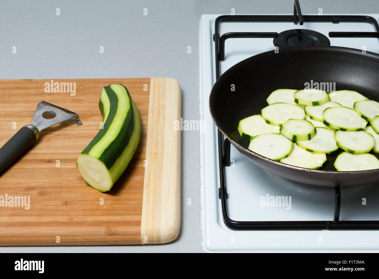 frying pan sliced courgette zucchini Stock Photo - Alamy