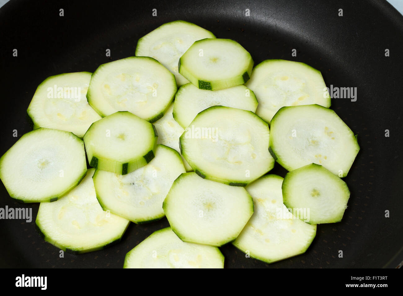 sliced courgette zucchini frying pan Stock Photo - Alamy