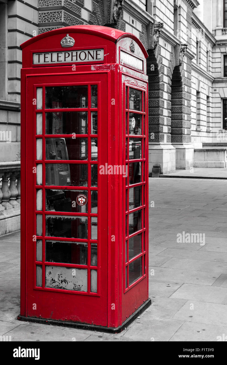 Single red telephone booth in London in bright red paint and with ...