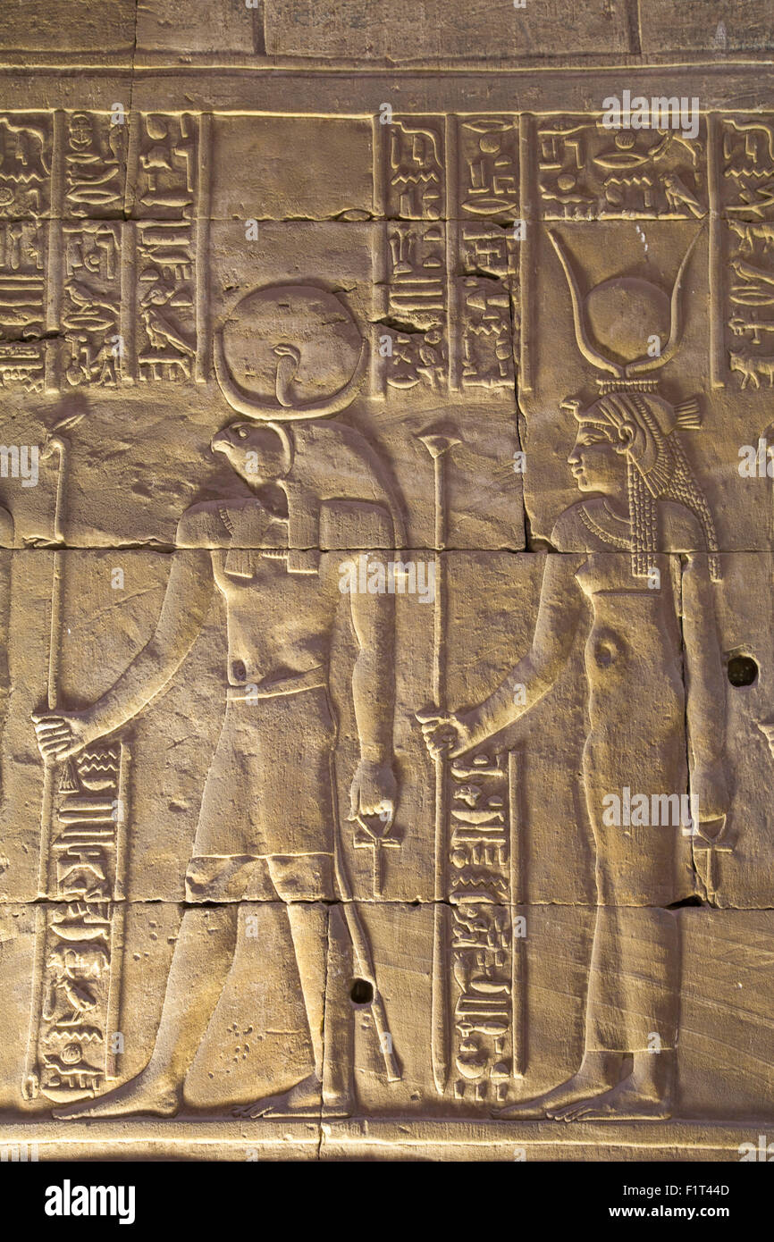 Relief depicting the God Horus on left and the Goddess Hathor on right ...