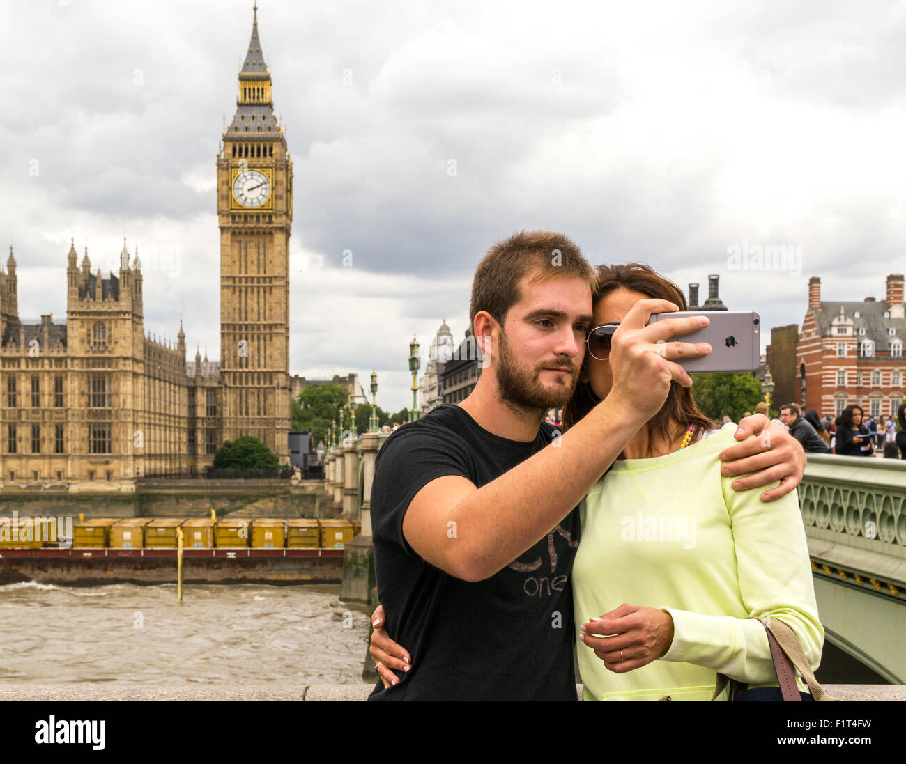 Two young tourists take a selfie photo of Big Ben and the The Houses of ...