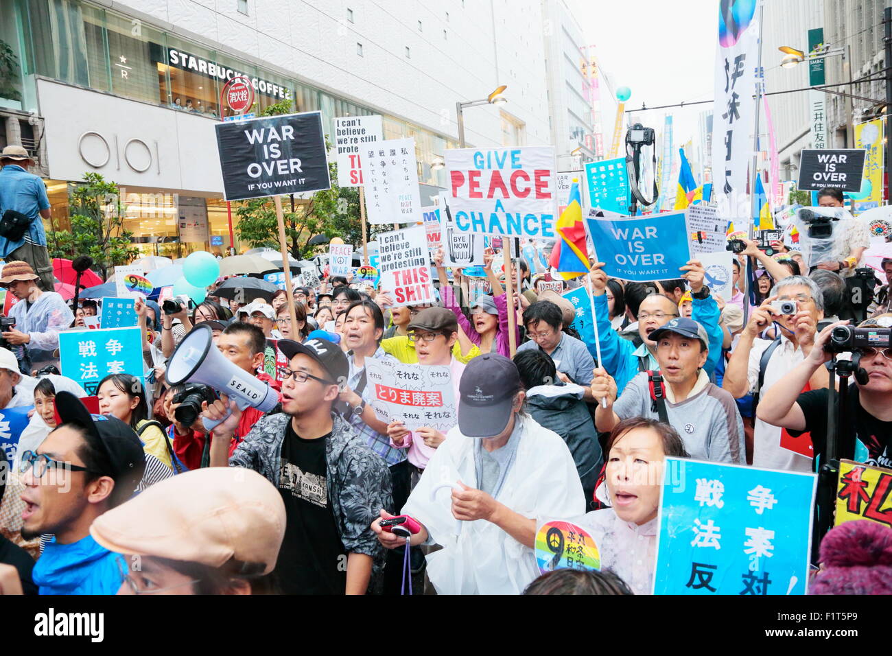 Protesters attend the rally against the government's controversial ...