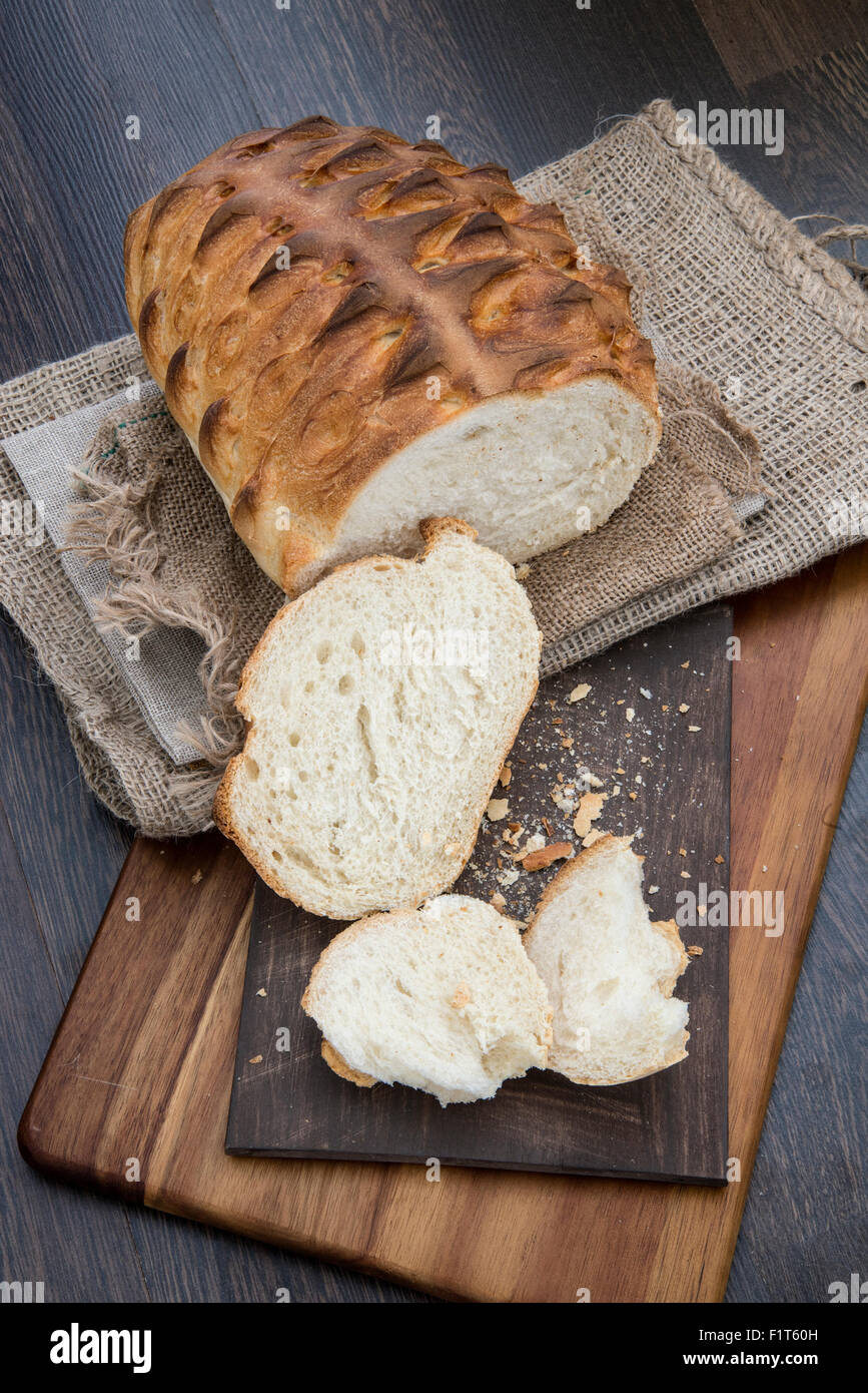 Fresh rustic loaf of bread in farmhouse setting Stock Photo - Alamy