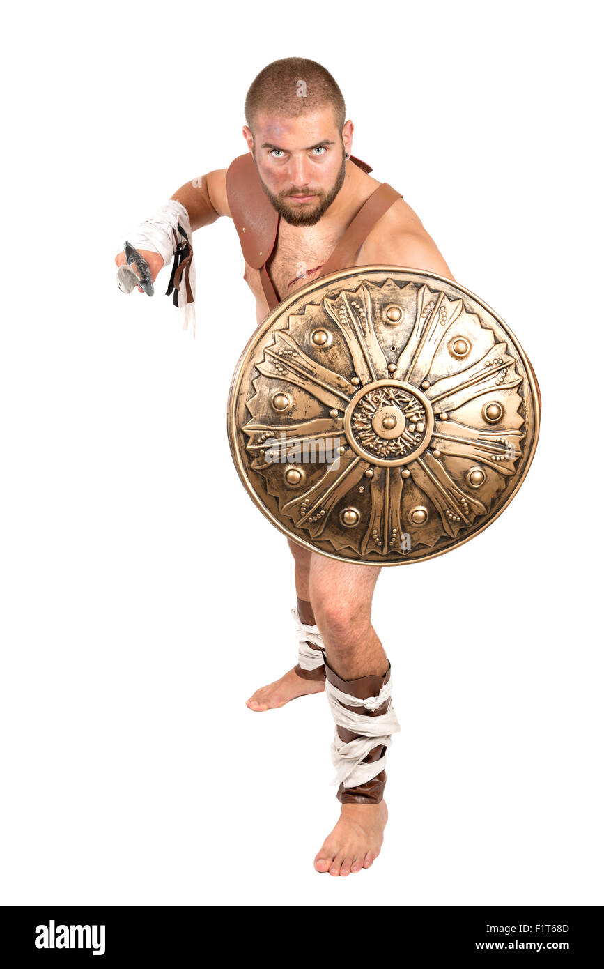 Gladiator posing with shield and sword isolated in white Stock Photo ...