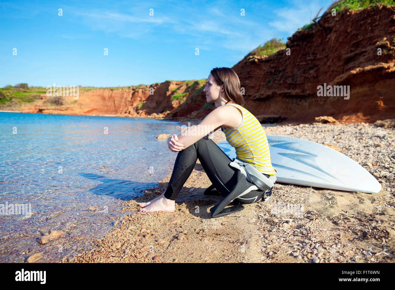 Female surfer on beach Stock Photo - Alamy