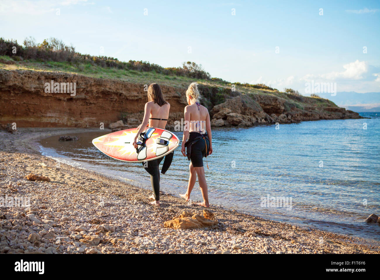 Female surfers on beach Stock Photo - Alamy