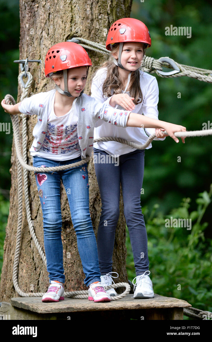 Children exercise on an assault course at an activity centre in ...