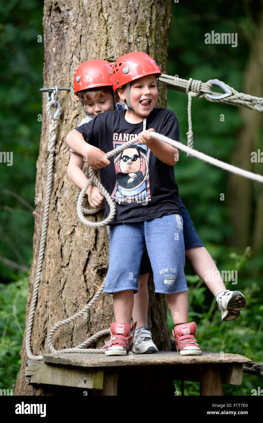 Children exercise on an assault course at an activity centre in ...