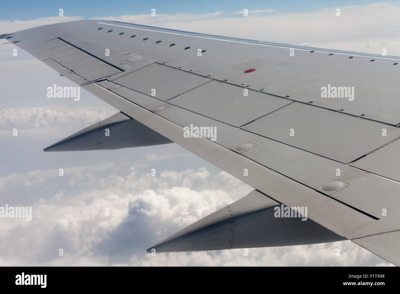 Beautiful view of airplane wing on blue sky background Stock Photo - Alamy