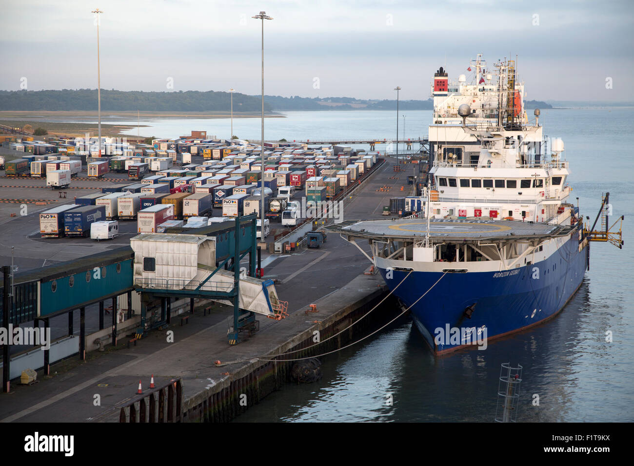 Ships and parked HGVs on quayside at the port of Harwich, Essex ...