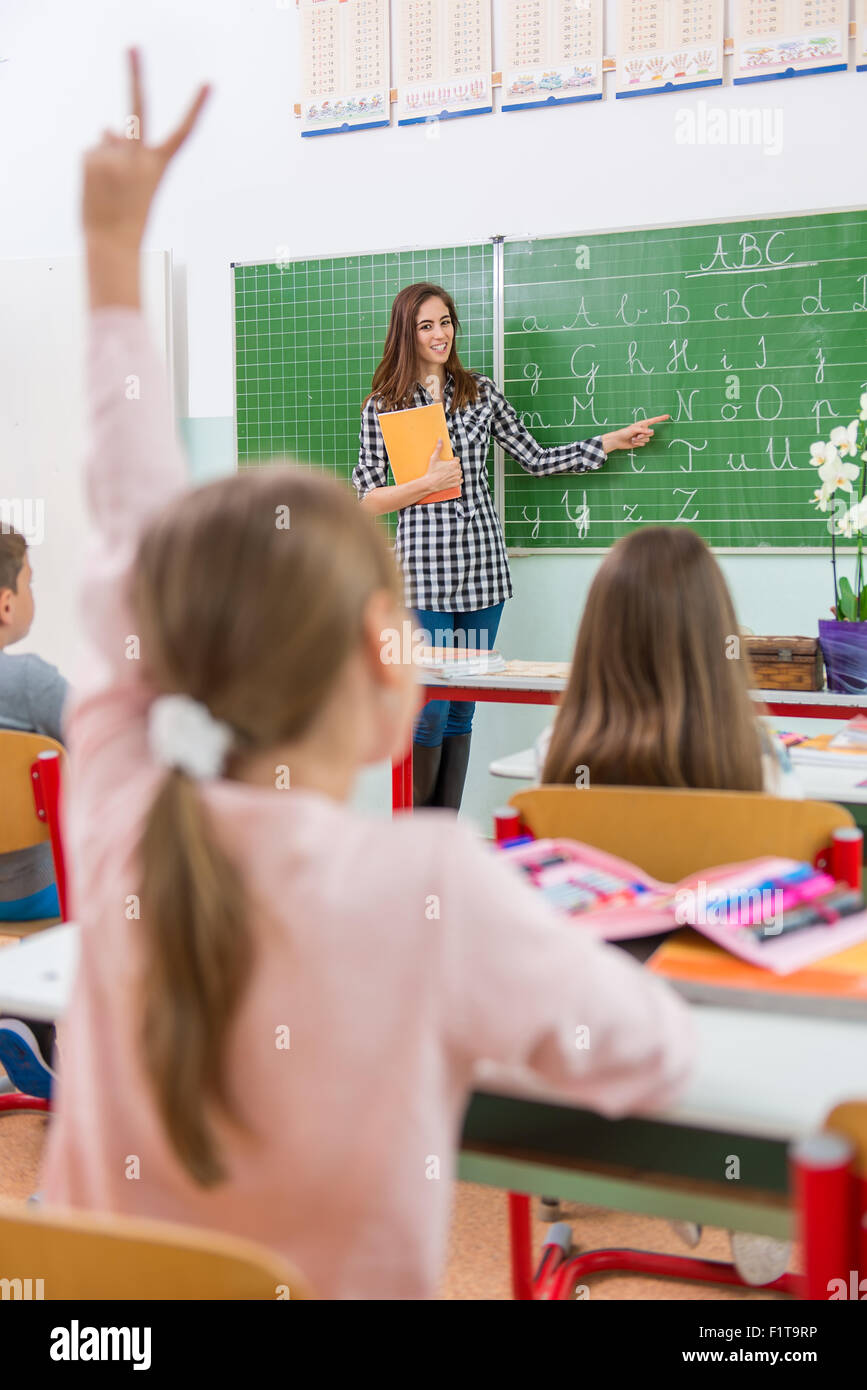 Teacher and students in the classroom: teaching Stock Photo - Alamy