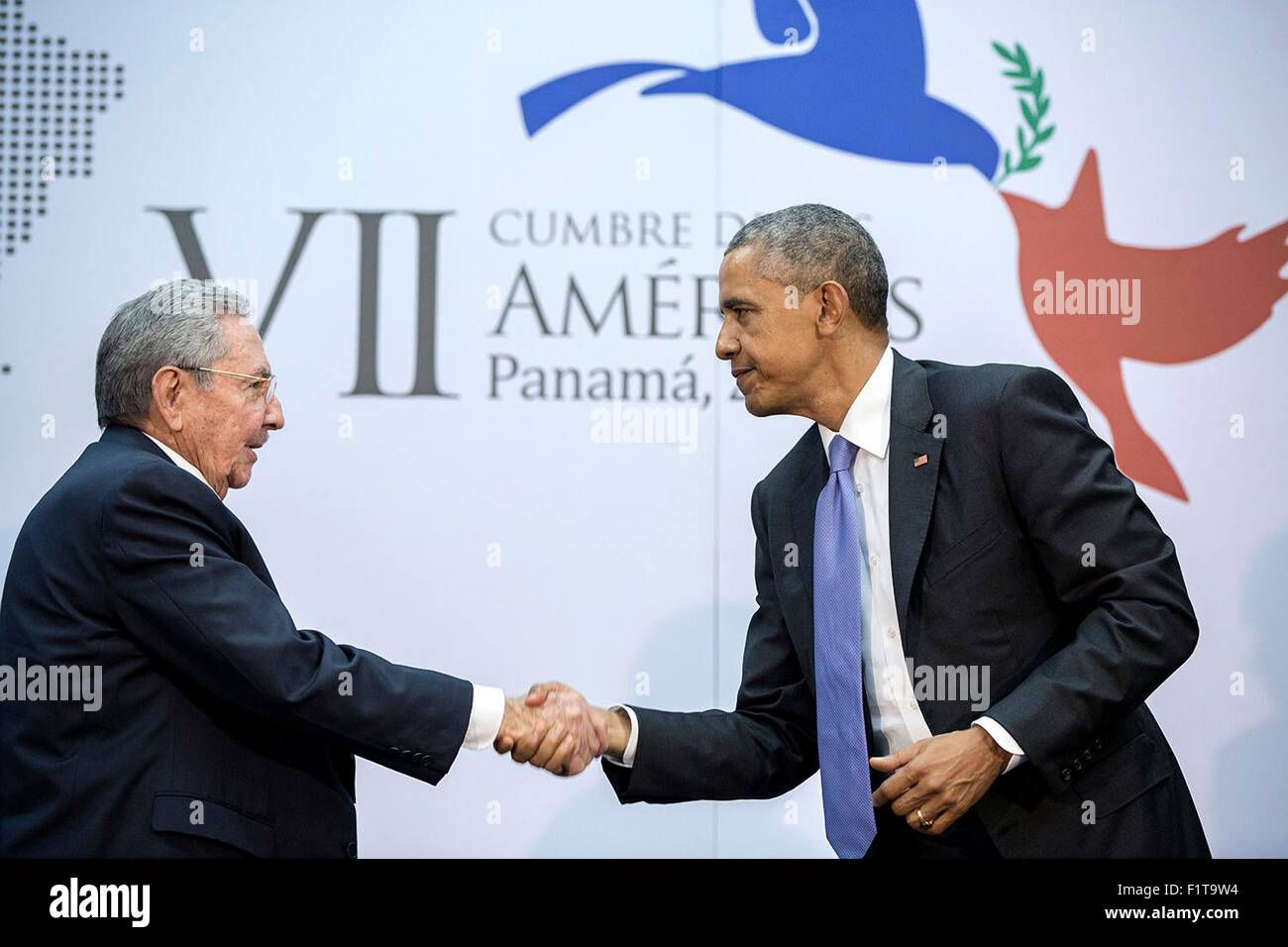 U.S. President Barack Obama shakes hands with Cuban President Rau l ...