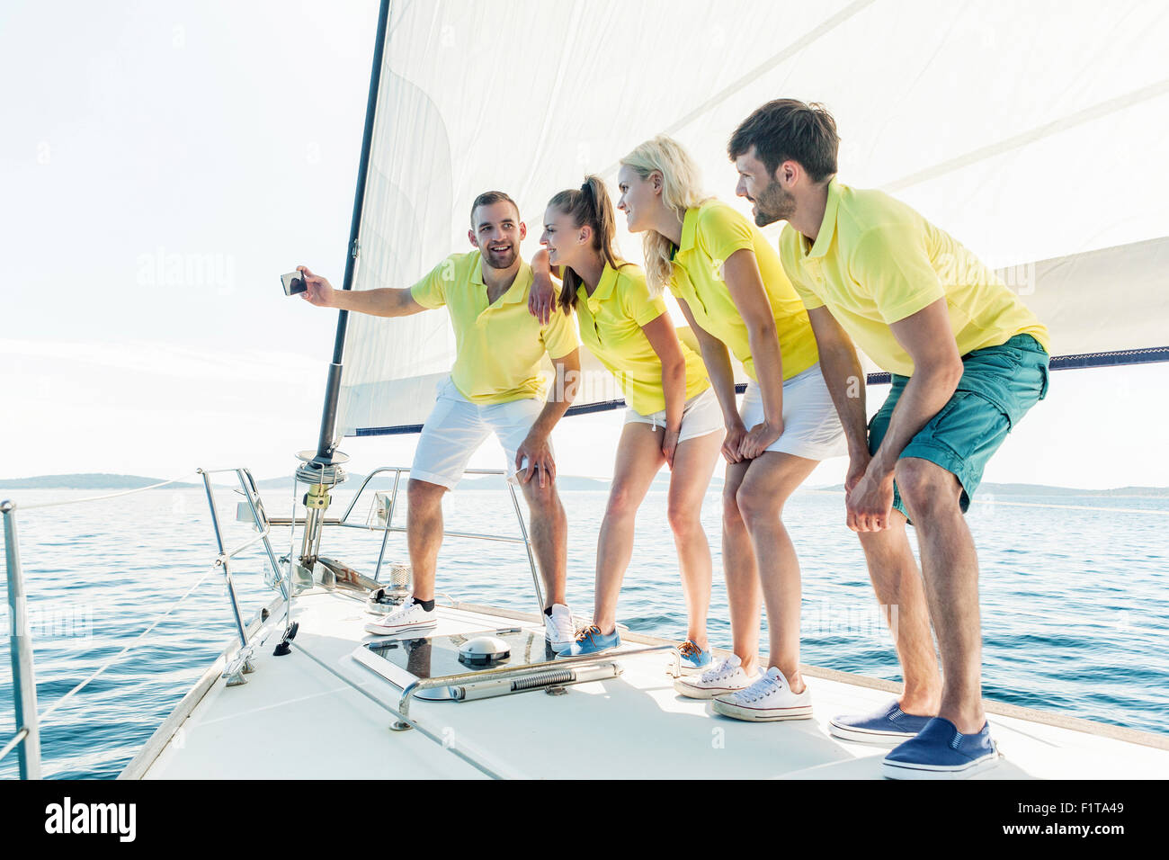 Group of friends taking pictures on sailboat, Adriatic Sea Stock Photo ...
