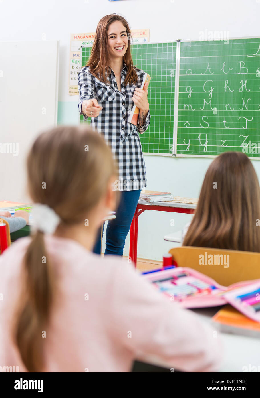 Teacher and students in the classroom: teaching Stock Photo - Alamy