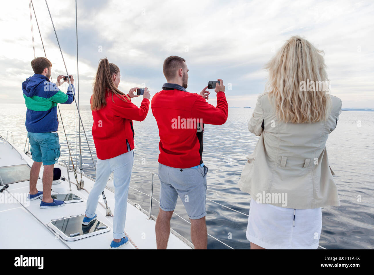Group of friends taking pictures on sailboat, Adriatic Sea Stock Photo ...