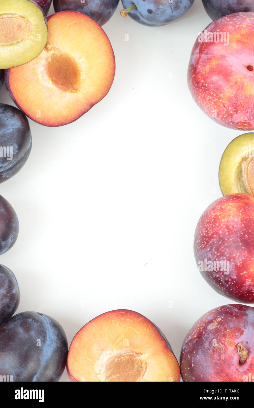 Closeup of a frame made of ripe plums isolated on white Stock Photo - Alamy