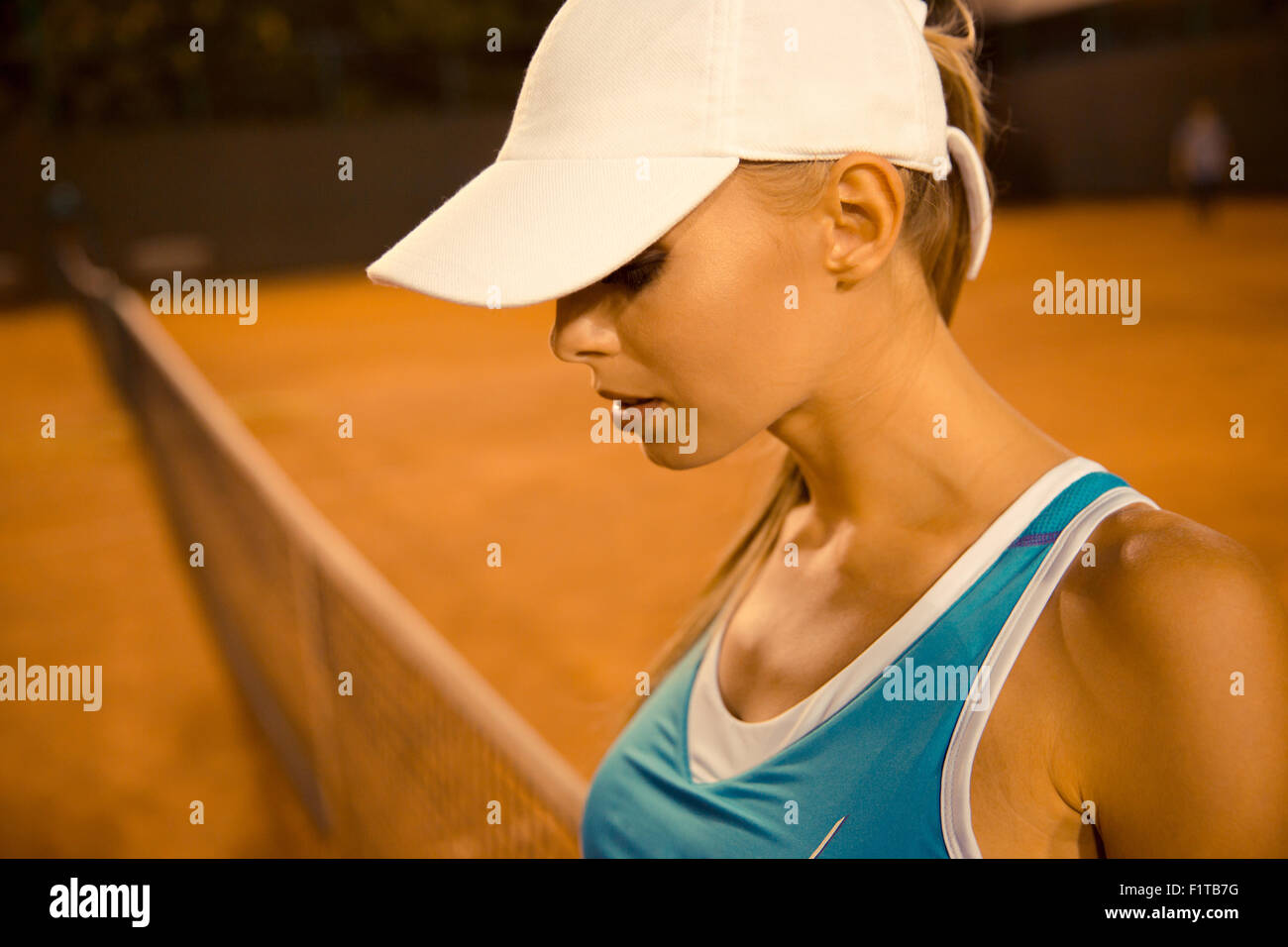 Portrait of a sports woman in cap Stock Photo - Alamy