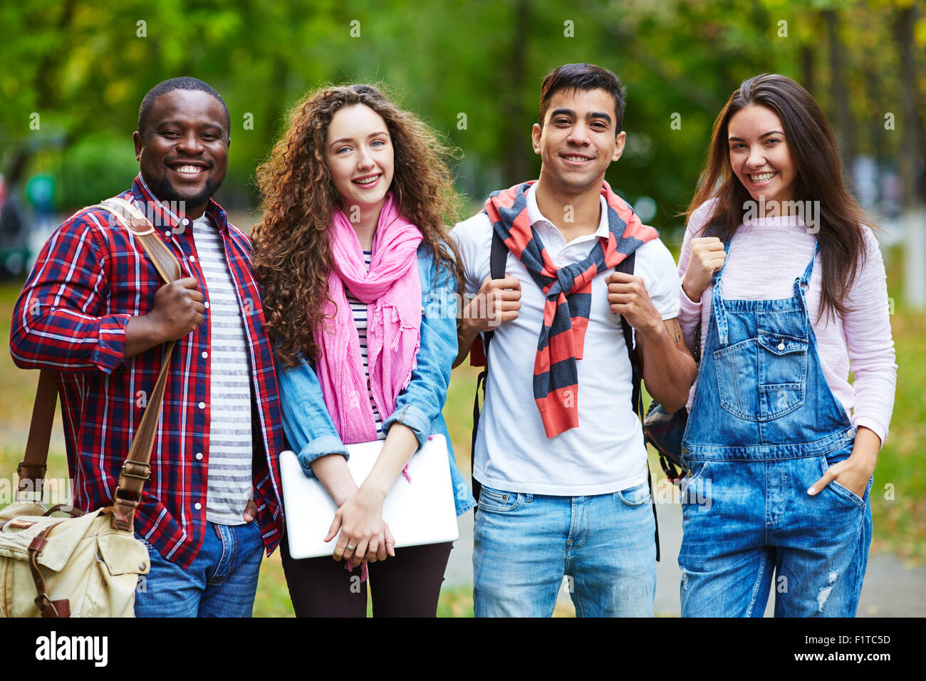 Friendly students standing in line outside Stock Photo - Alamy